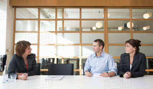 Three people in meeting - Stock Photo - Dissolve