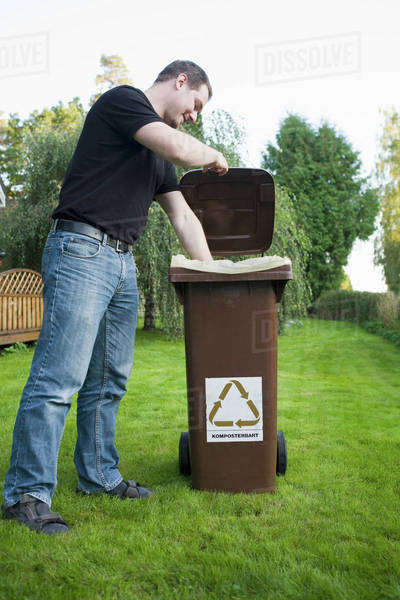 Man throwing the garbage - Stock Photo - Dissolve