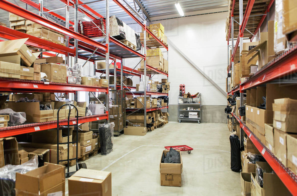 Stack of cardboard boxes on rack in industry - Royalty-free Stock Photo ...