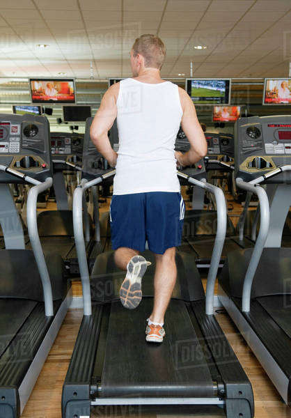 Guy on treadmill - Royalty-free Stock Photo | Dissolve