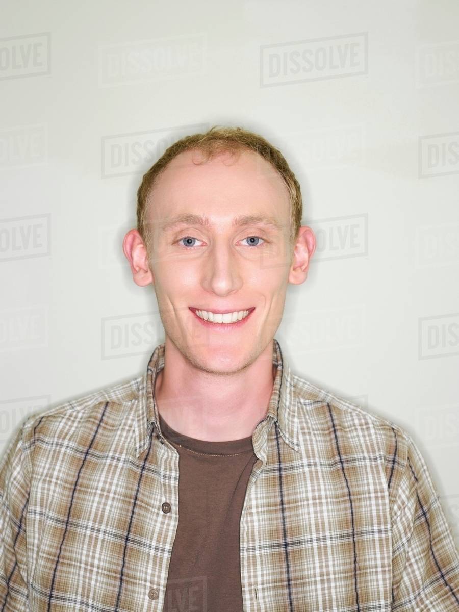 Portrait of geeky young man - Stock Photo - Dissolve