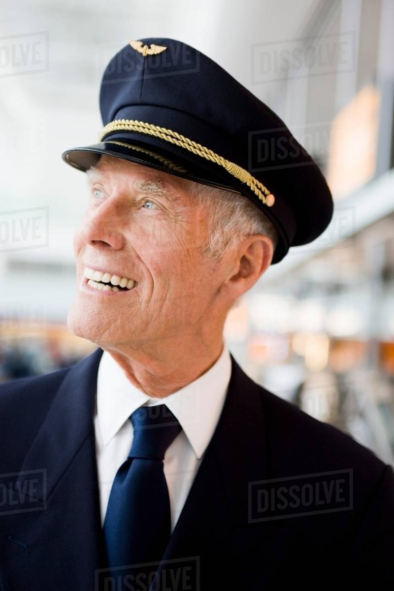 Flight captain smiling - Royalty-free Stock Photo | Dissolve