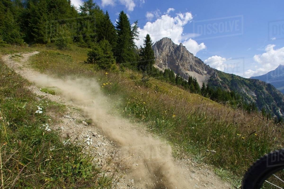 Dust from a bike wheel on a track - Royalty-free Stock Photo | Dissolve