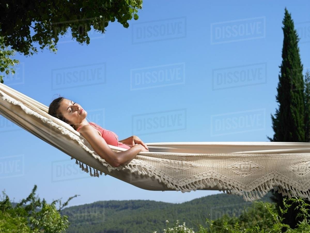 Girl resting in hammock - Royalty-free Stock Photo | Dissolve