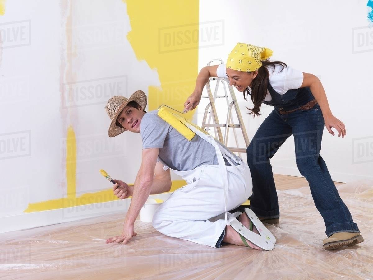 Couple messing around with paint. - Royalty-free Stock Photo | Dissolve