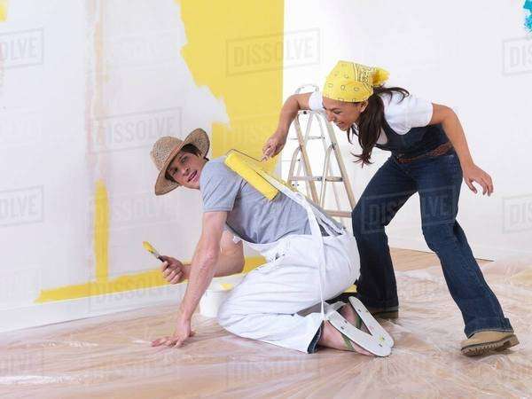 Couple messing around with paint. - Royalty-free Stock Photo | Dissolve