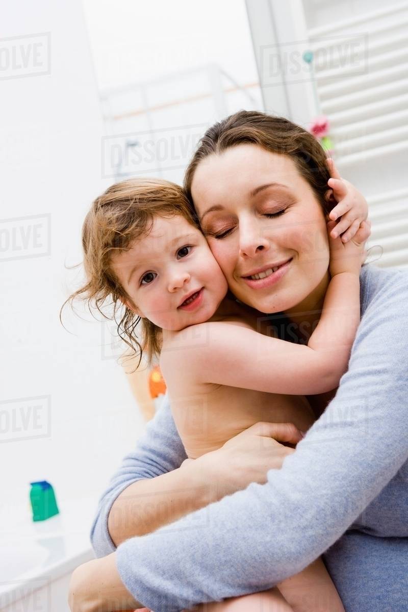 Mother hugging her baby - Royalty-free Stock Photo | Dissolve