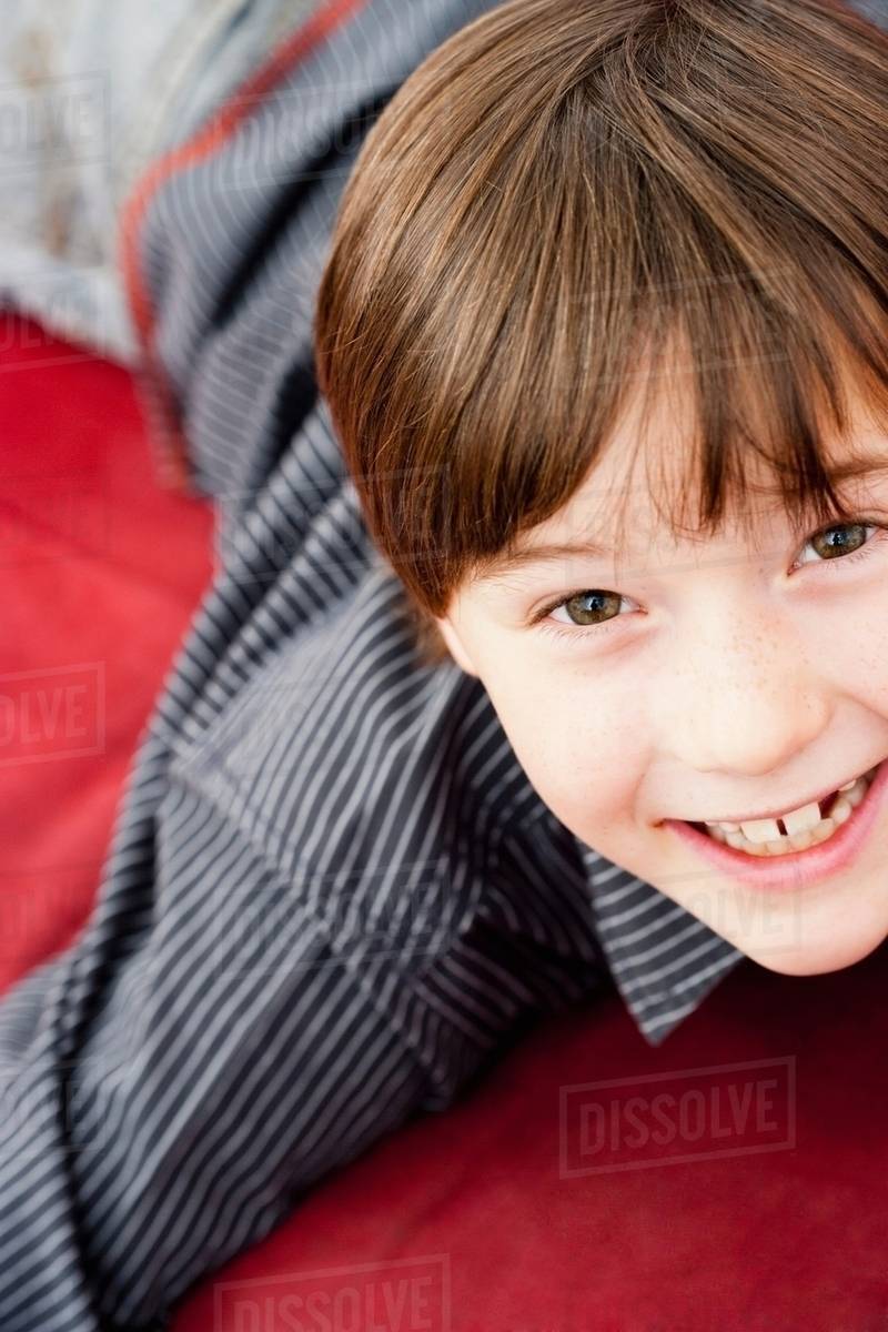 Boy looking up to camera - Royalty-free Stock Photo | Dissolve