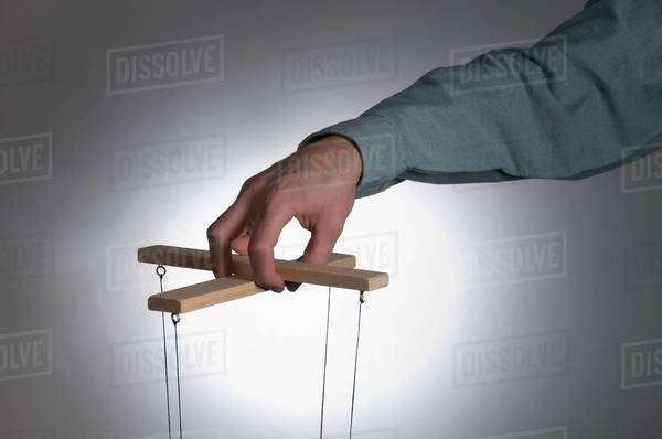 Male operating puppet controls - Royalty-free Stock Photo | Dissolve