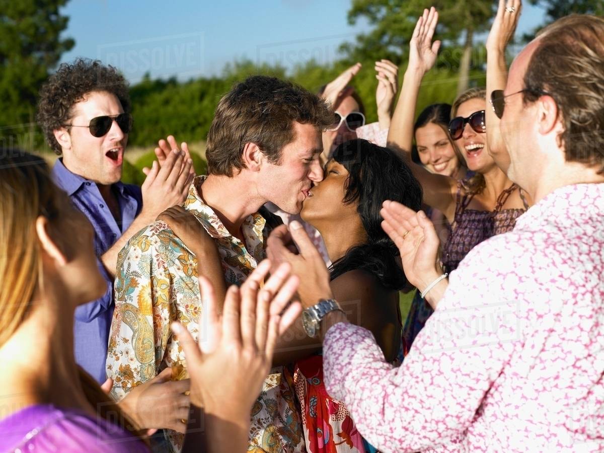 Couple kissing, people clapping hands - Stock Photo - Dissolve