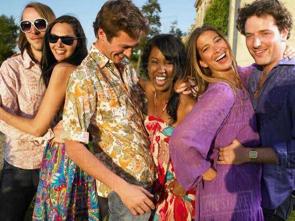 Three couples smiling at sunset - Stock Photo - Dissolve