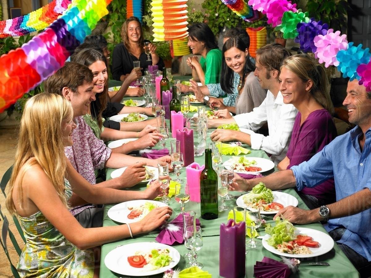 People sitting at table, celebrating - Stock Photo - Dissolve