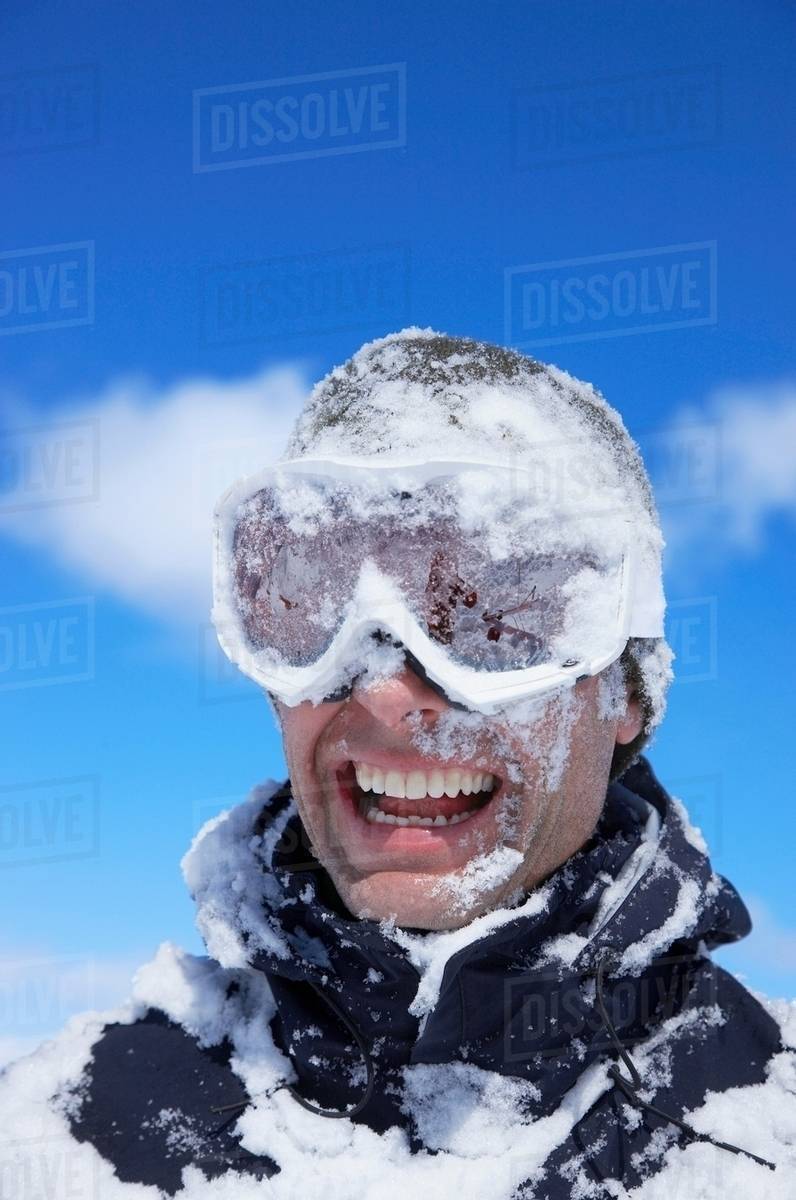 Man laughing, face covered with snow - Royalty-free Stock Photo | Dissolve