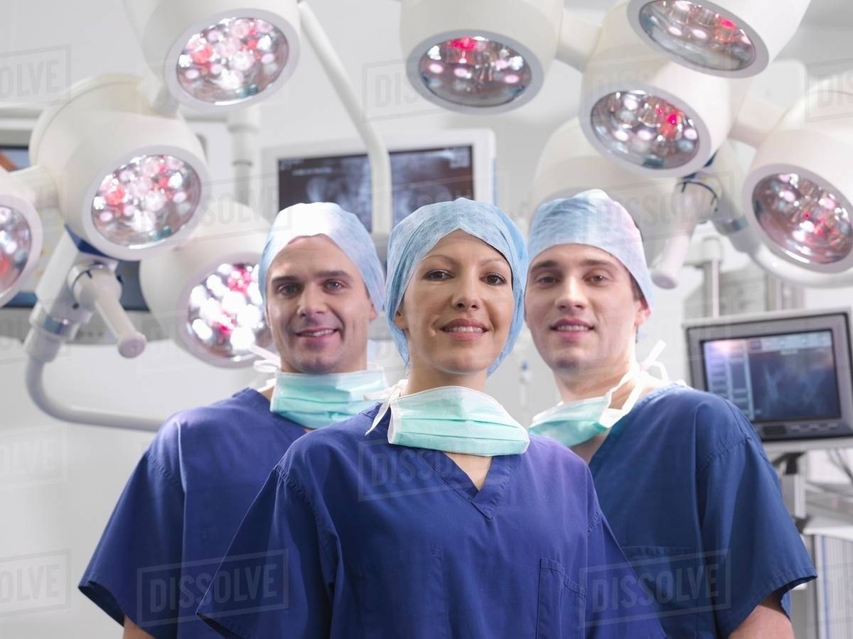 Group of nurses in operating theatre - Stock Photo - Dissolve