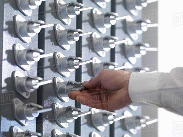 Operator turning key - Stock Photo - Dissolve