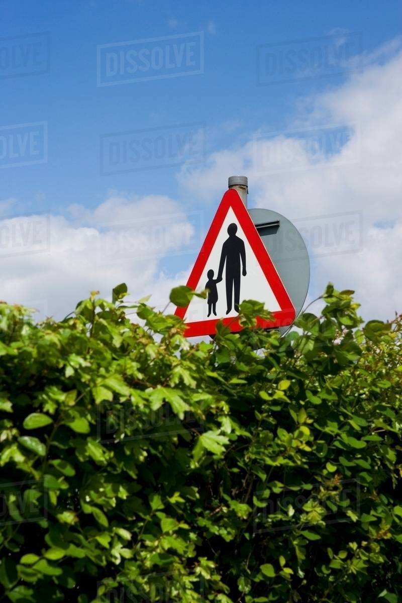 Adult child warning road sign - Stock Photo - Dissolve