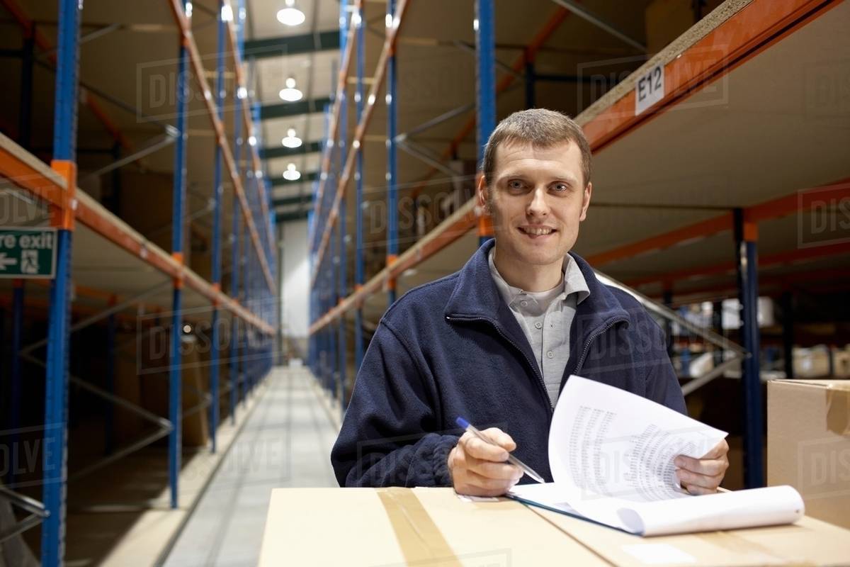 Worker in warehouse portrait - Royalty-free Stock Photo | Dissolve