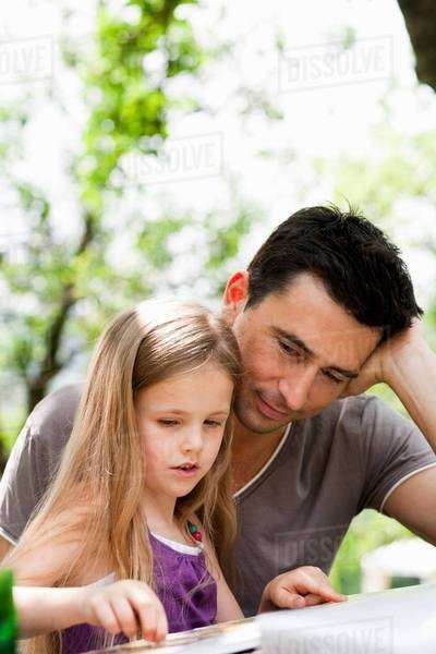 Father And Daughter Learning - Stock Photo - Dissolve