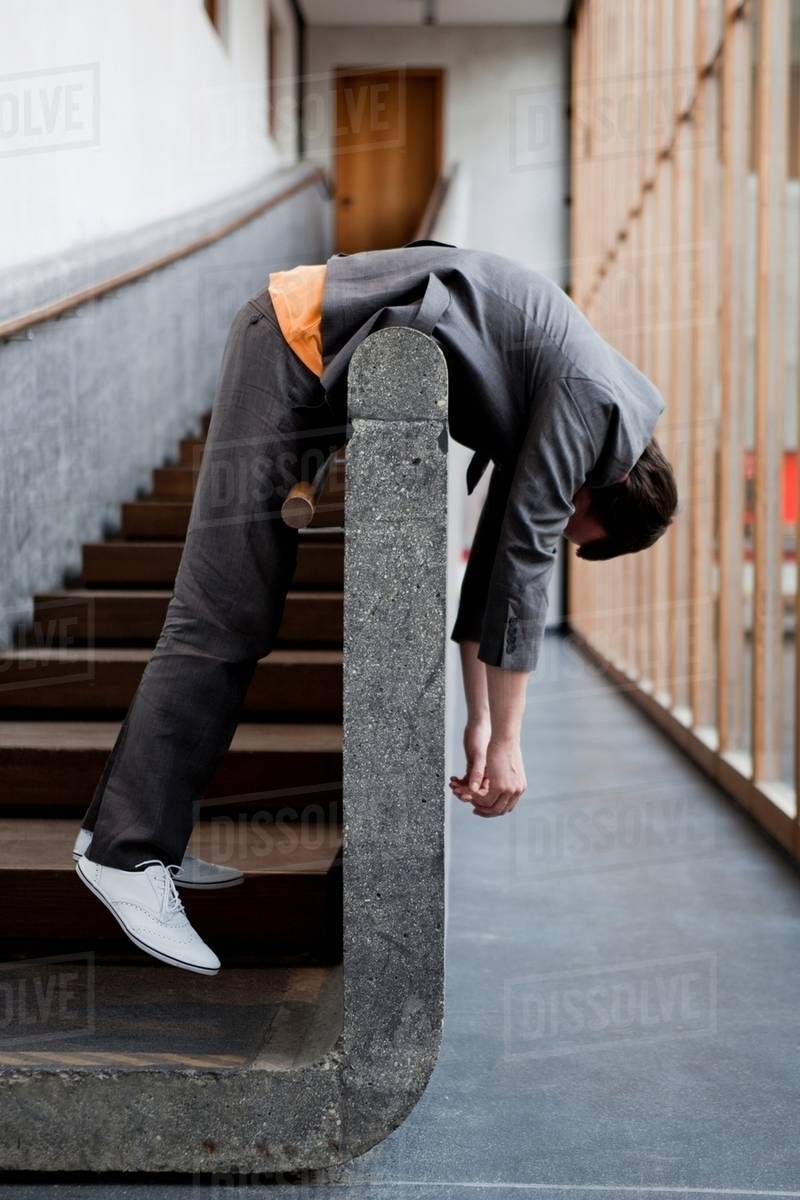 Man leaning over on railing - Royalty-free Stock Photo | Dissolve