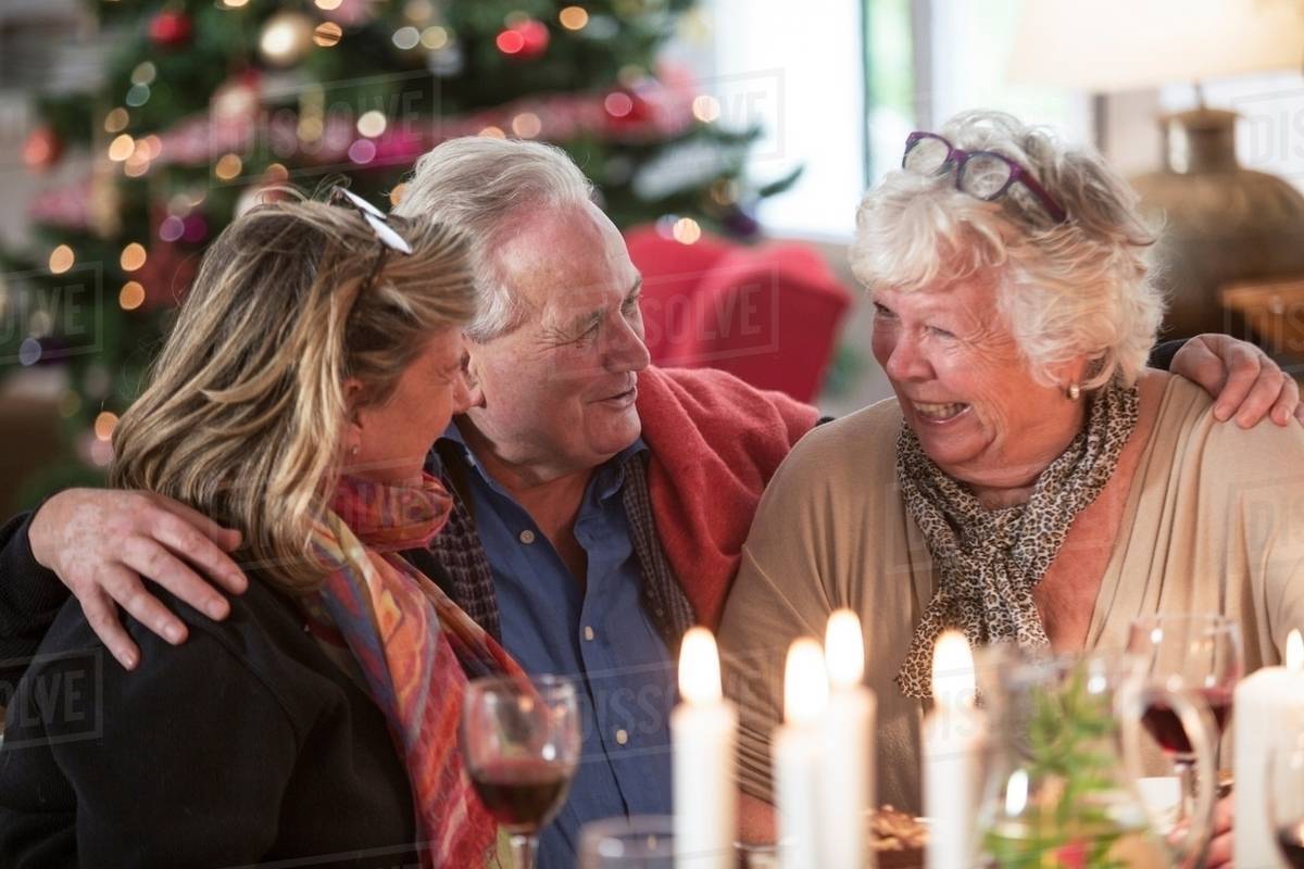 Senior Family Laughing At Christmas Lunch Table Stock Photo Dissolve senior-family-laughing-at-christmas-lunch-table-stock-photo-dissolve