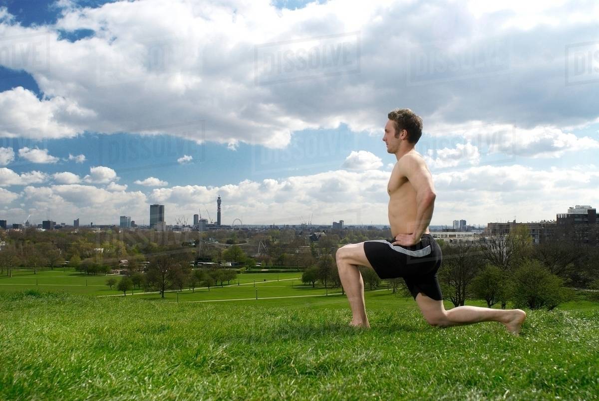 Man lunging in park - Royalty-free Stock Photo | Dissolve