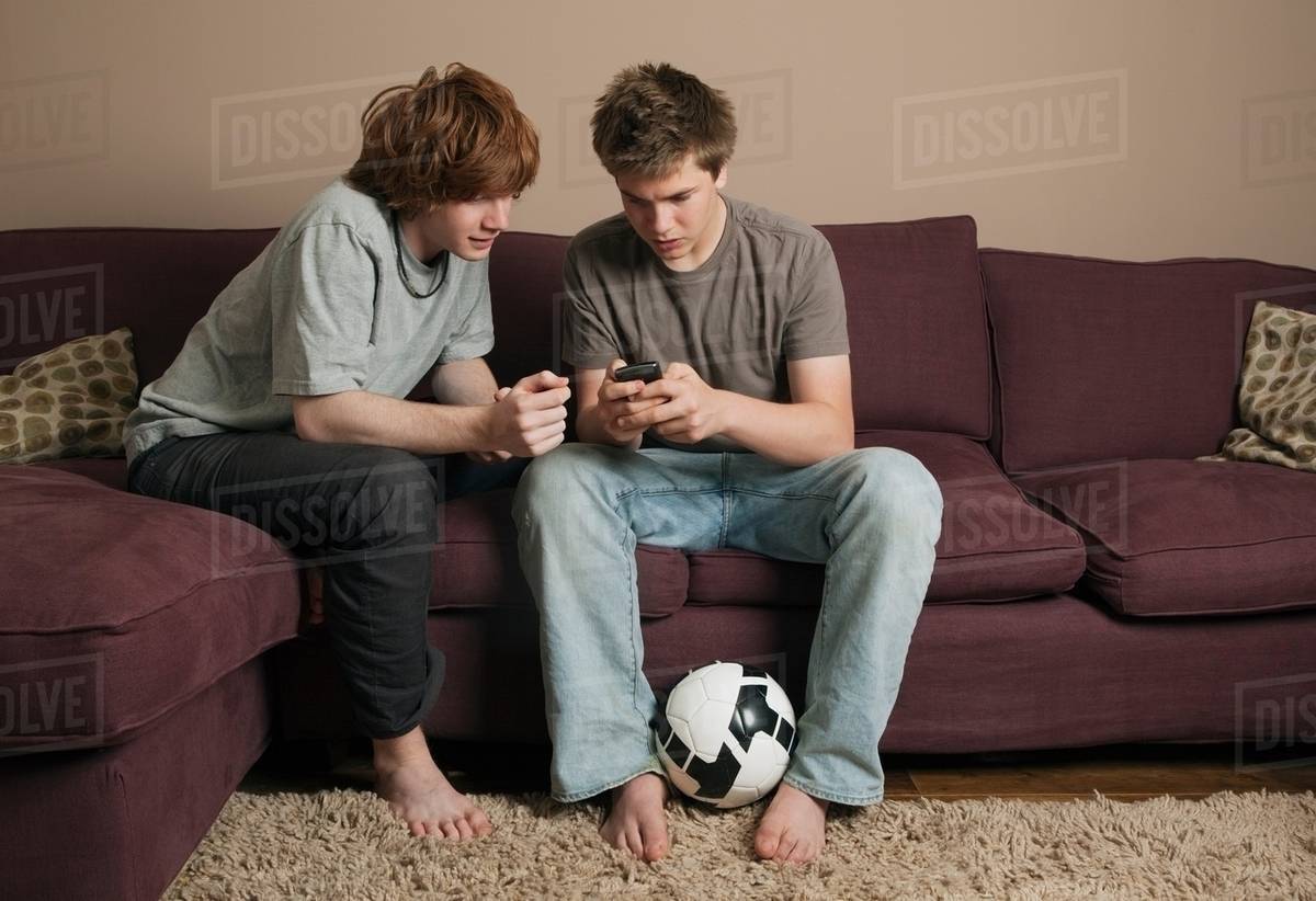 Boys sending message from mobile phone - Royalty-free Stock Photo ...