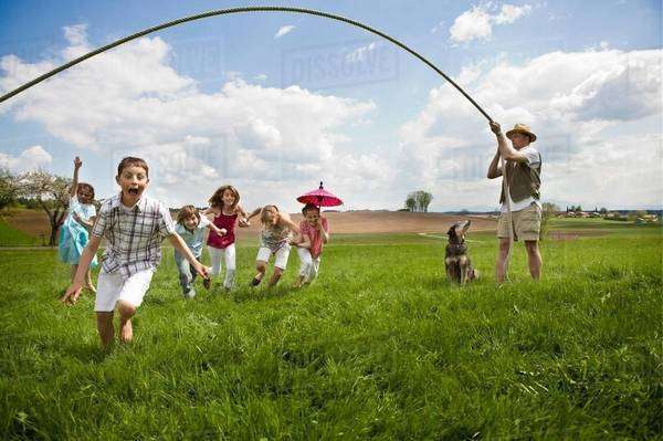 Family having fun in countryside - Royalty-free Stock Photo | Dissolve