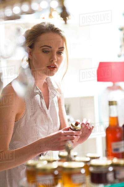 Girl is rummaging in a store - Stock Photo - Dissolve