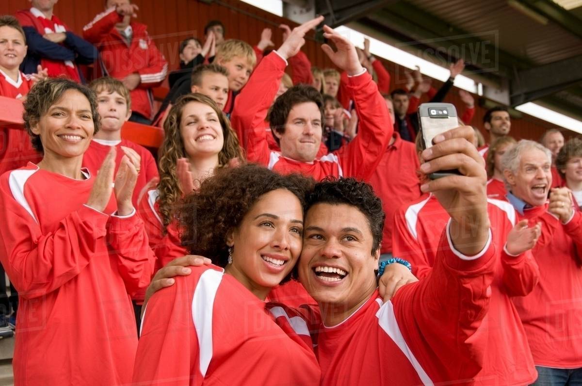 Football fans photographing themselves - Royalty-free Stock Photo ...