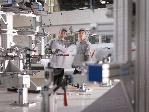 Car Plant Workers On Production Line - Stock Photo - Dissolve