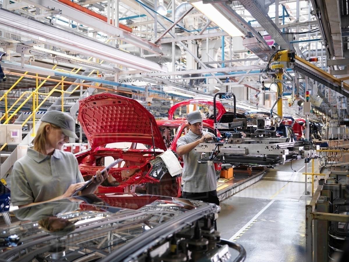 Car Plant Workers On Production Line - Stock Photo - Dissolve