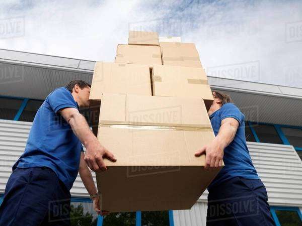 Two men carrying boxes - Royalty-free Stock Photo | Dissolve
