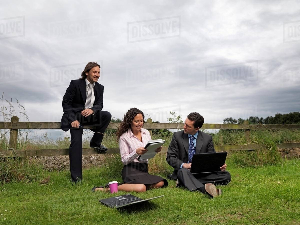 Business meeting in field - Royalty-free Stock Photo | Dissolve