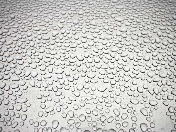 Water droplets on metal - Stock Photo - Dissolve