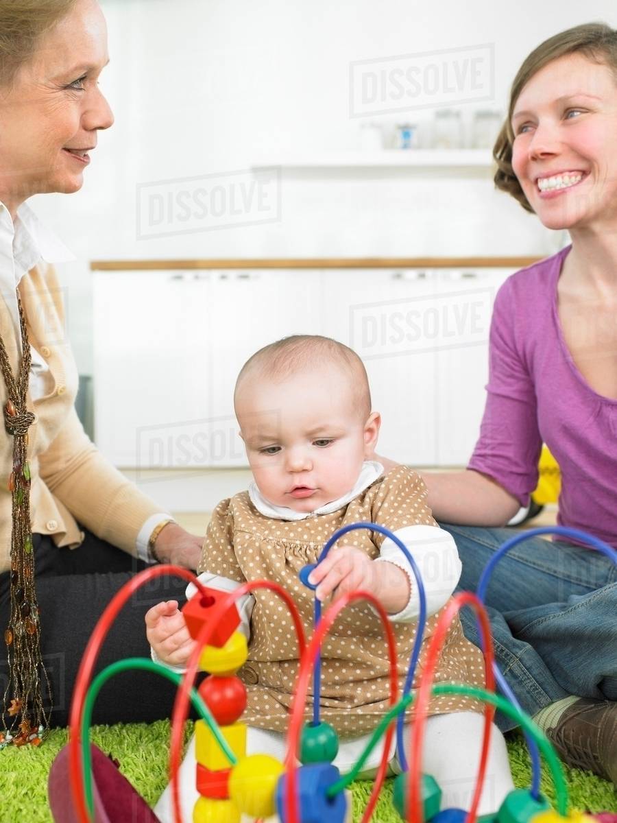 Family playing together - Stock Photo - Dissolve
