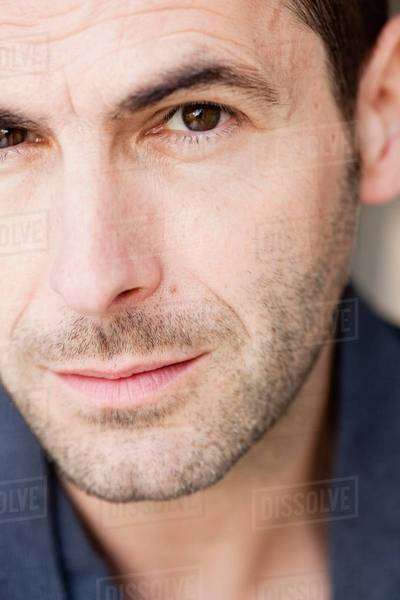 Man looking at viewer - Stock Photo - Dissolve