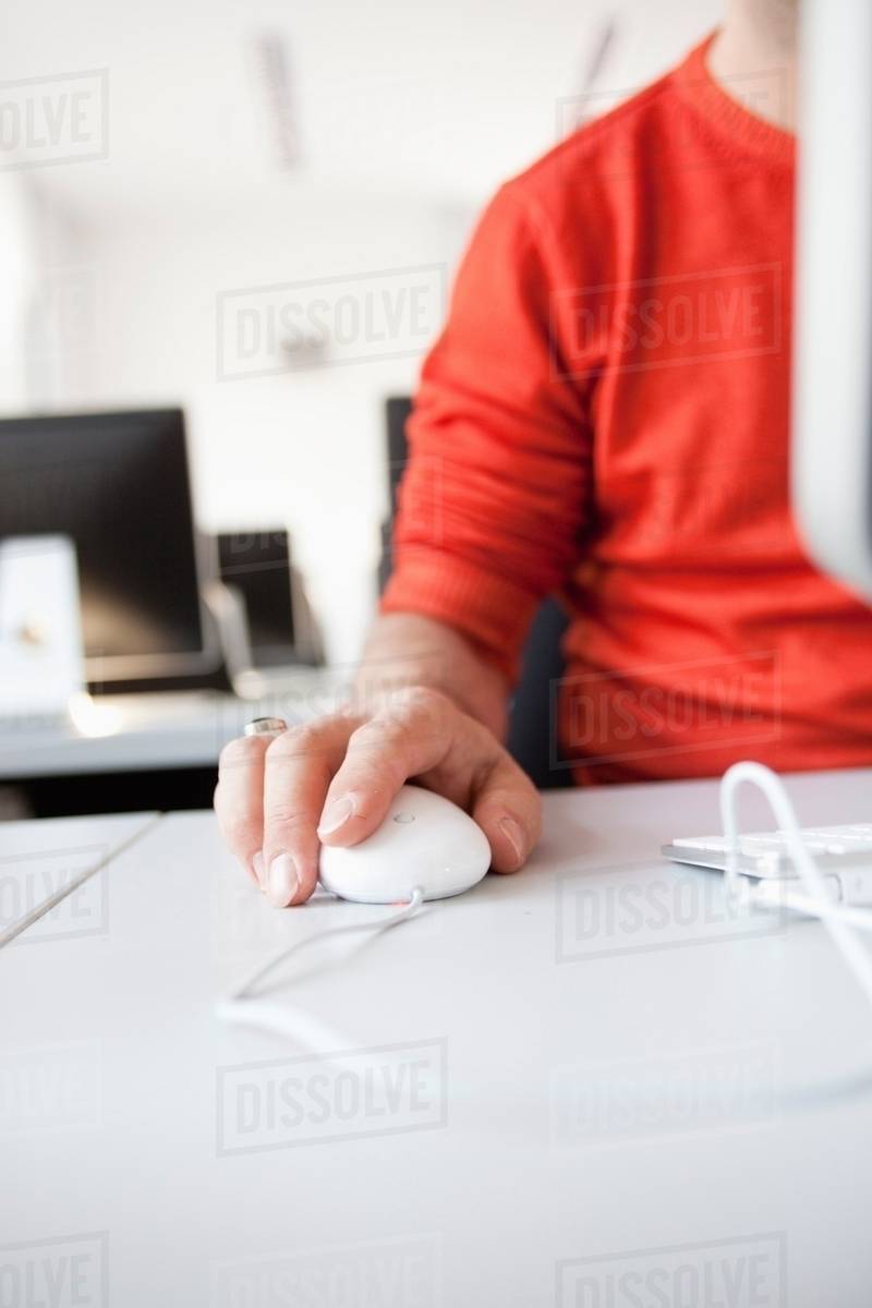 Man using computer mouse - Royalty-free Stock Photo | Dissolve
