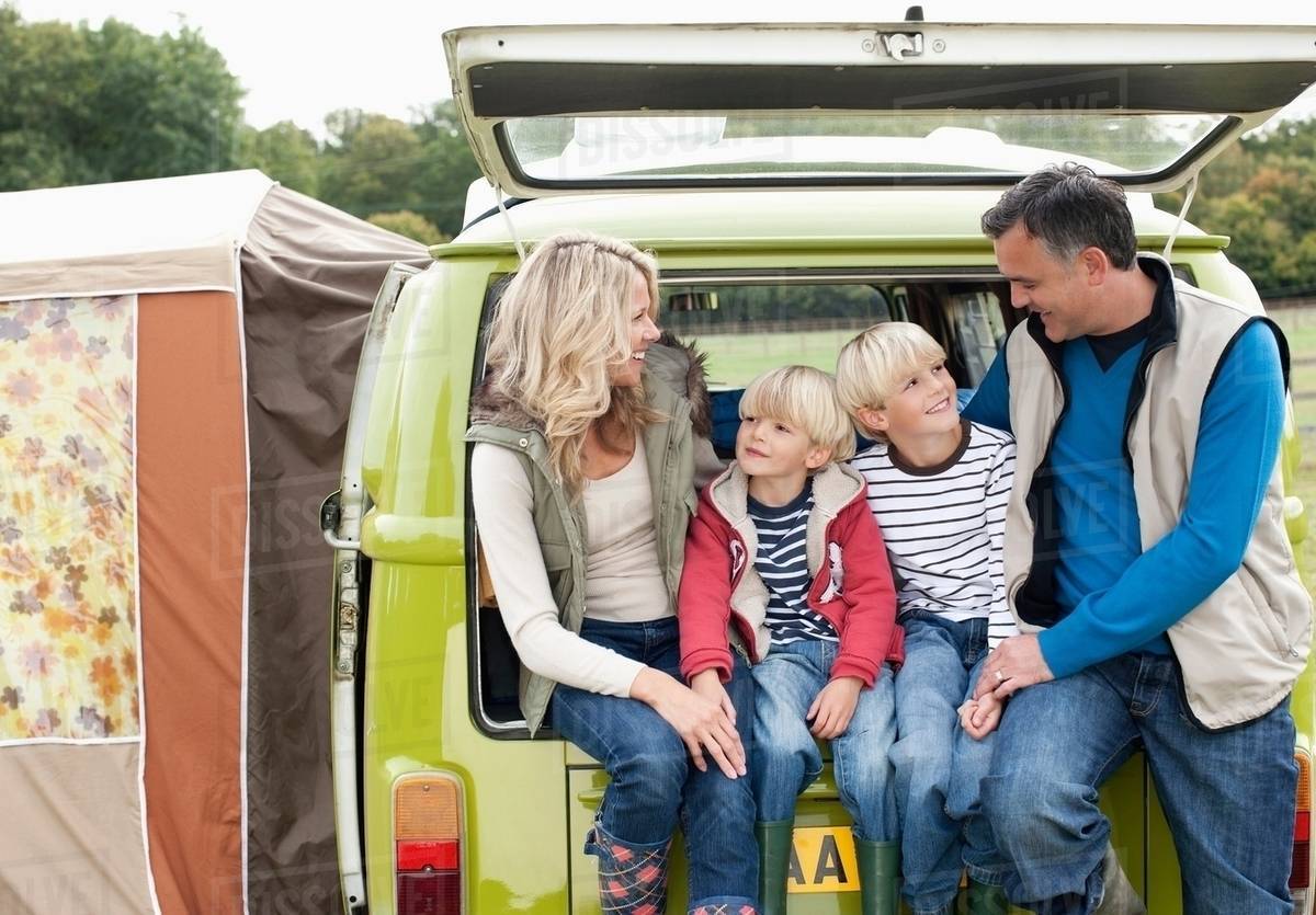 Family at back of camper van - Stock Photo - Dissolve