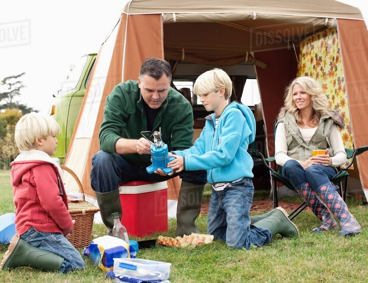 Family setting up camp - Royalty-free Stock Photo | Dissolve
