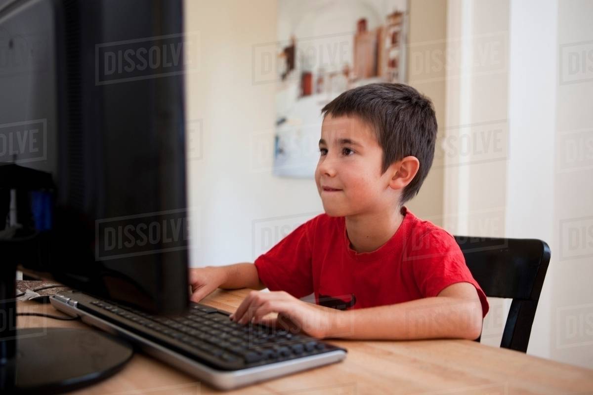 Little boy at the computer - Royalty-free Stock Photo | Dissolve