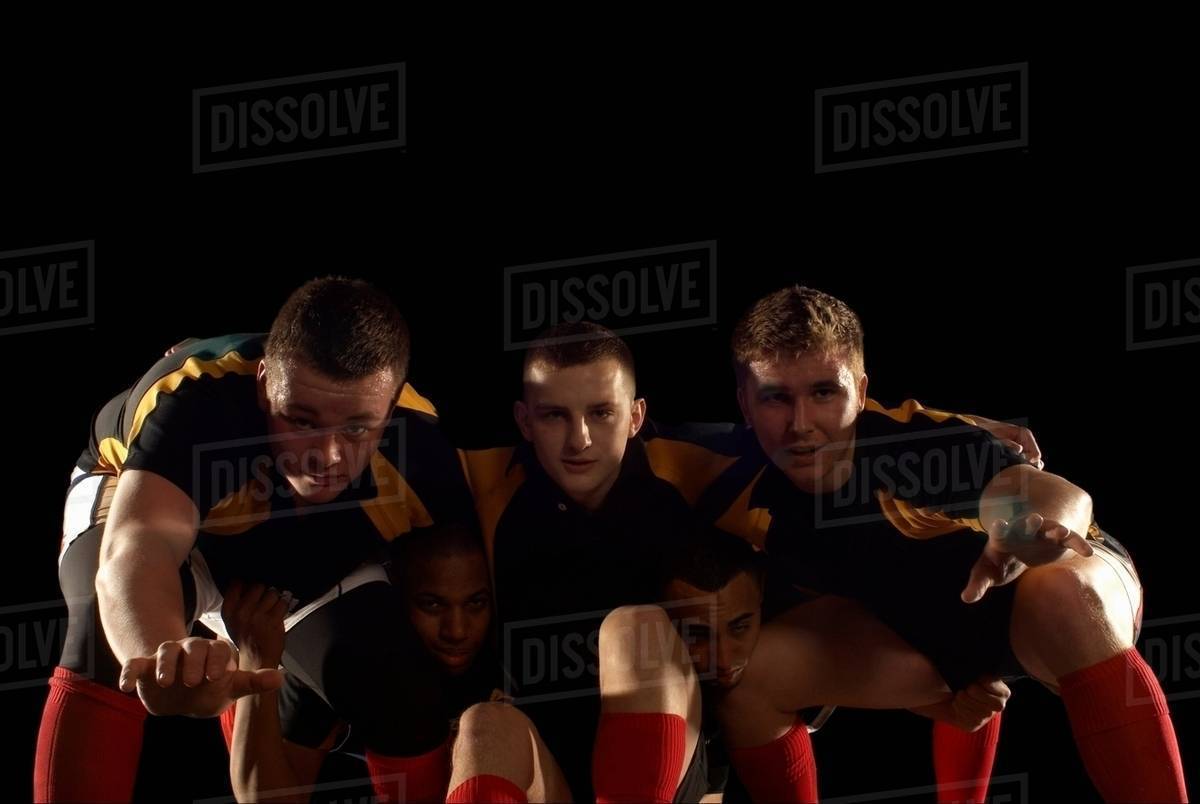 Rugby players in scrum formation - Royalty-free Stock Photo | Dissolve
