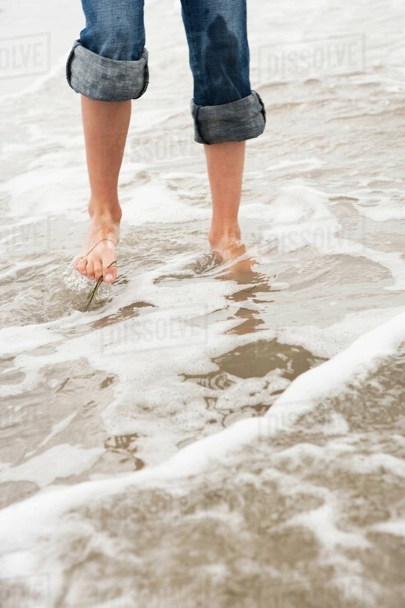 Girl wading in ocean - Royalty-free Stock Photo | Dissolve