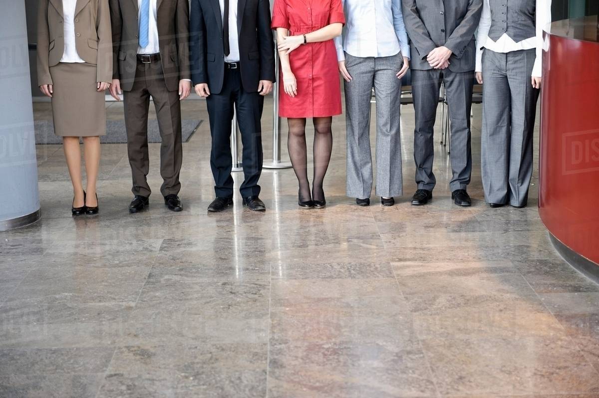 Business people standing in line - Stock Photo - Dissolve