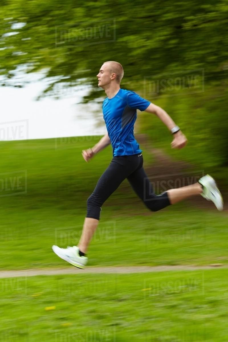 Man running in nature - Stock Photo - Dissolve