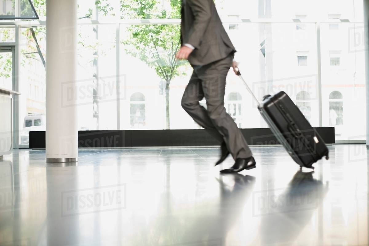 Man trying to catch his flight - Royalty-free Stock Photo | Dissolve