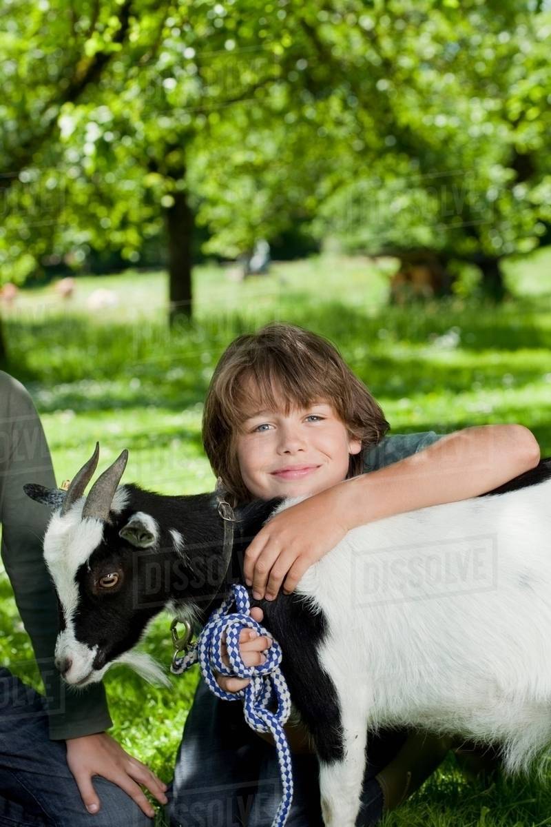 Boy with goat - Royalty-free Stock Photo | Dissolve