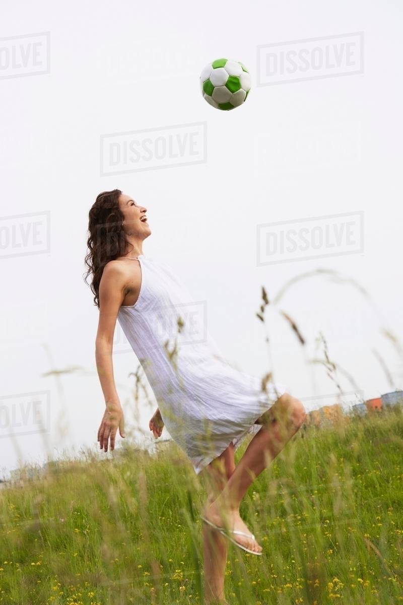 Woman playing soccer - Stock Photo - Dissolve