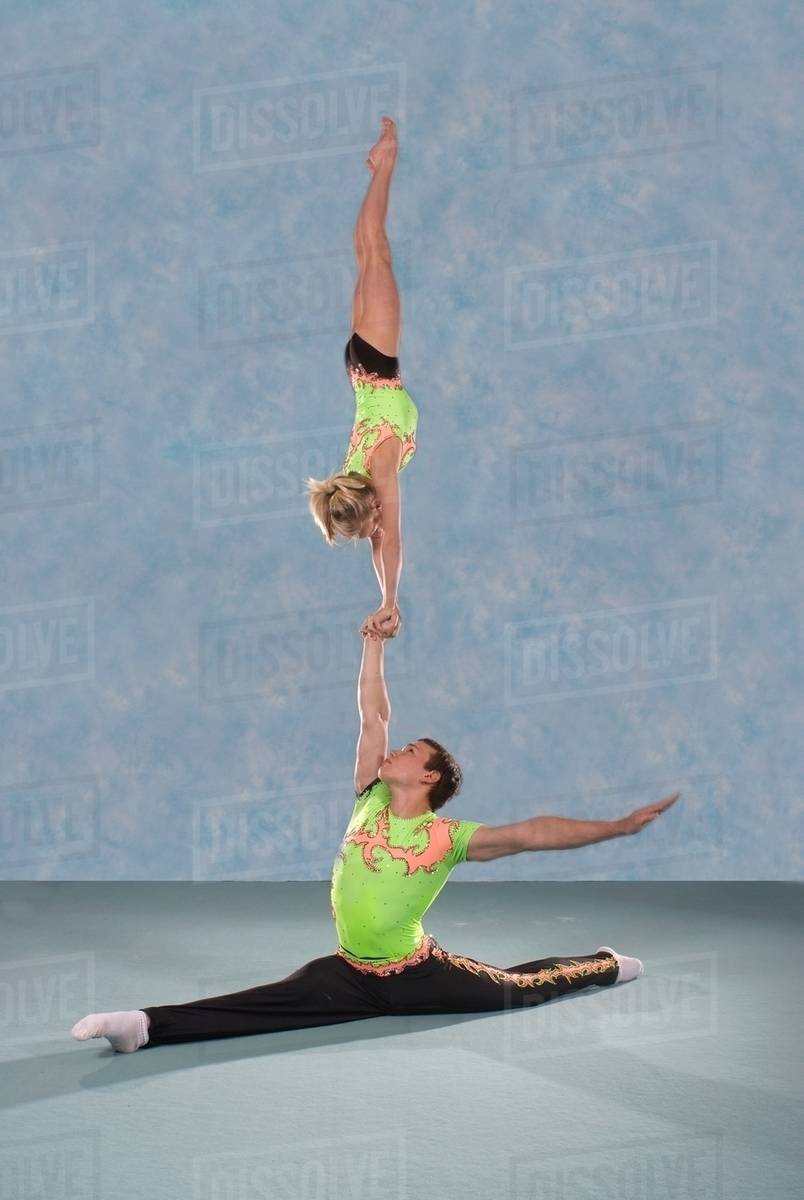 Acrobatic troop performing moves - Royalty-free Stock Photo | Dissolve