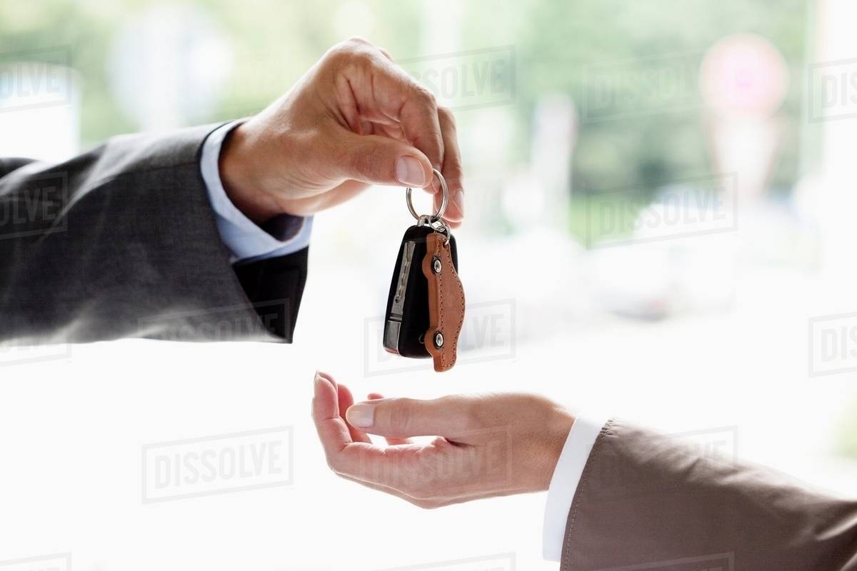Handing over key - Royalty-free Stock Photo | Dissolve