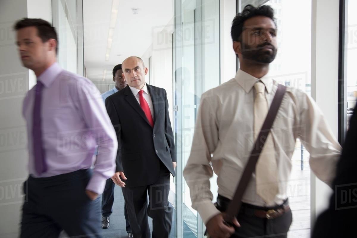 Business people walking fast past camera - Royalty-free Stock Photo ...